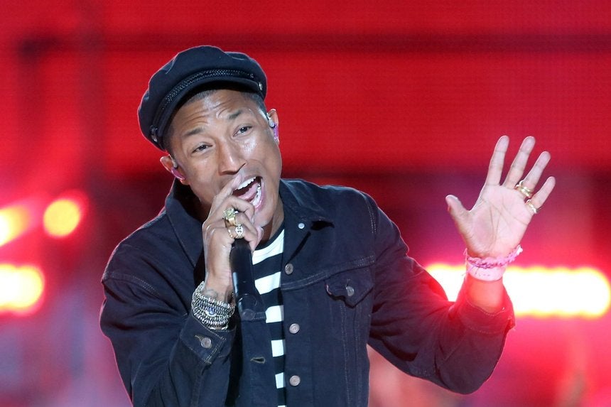 Pharrell Gives 50,000 Books to Children in Need - Essence