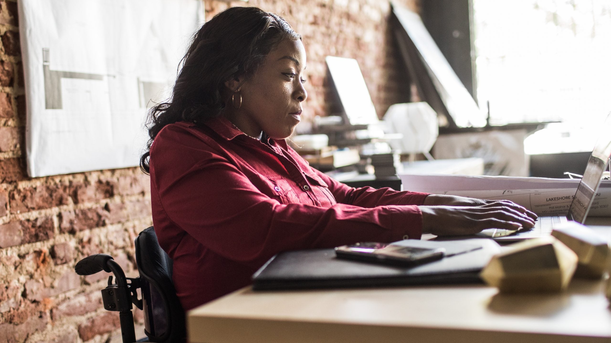 Black Woman Working At Desk